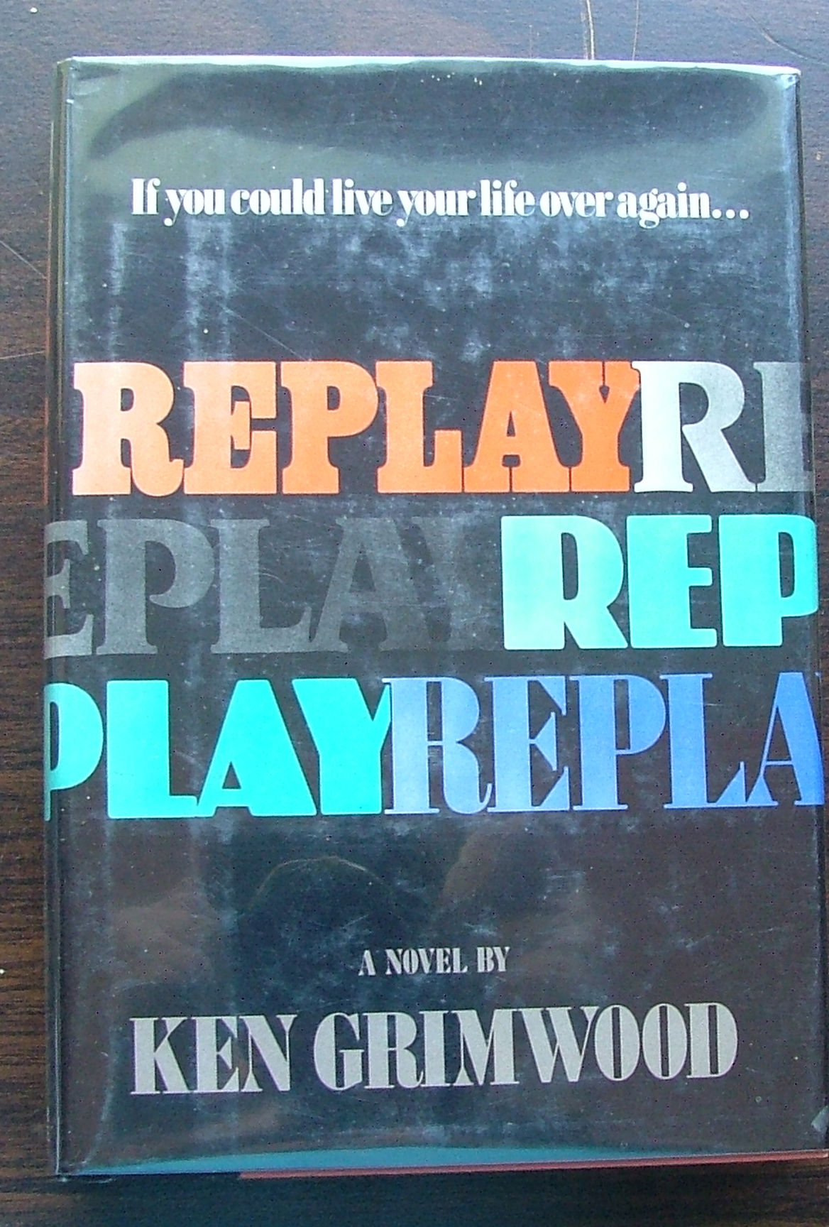 Replay by Grimwood, Ken | Hardcover 8vo. Orange paper covered boards ...